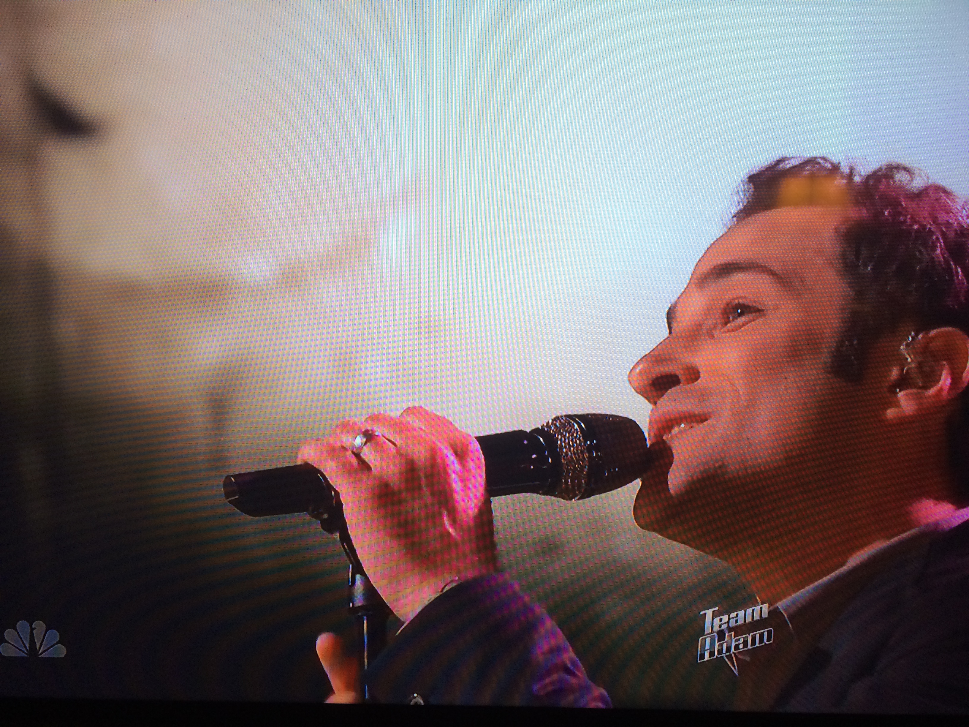 Joshua Davis soars to Top 10 on The Voice with ‘America’