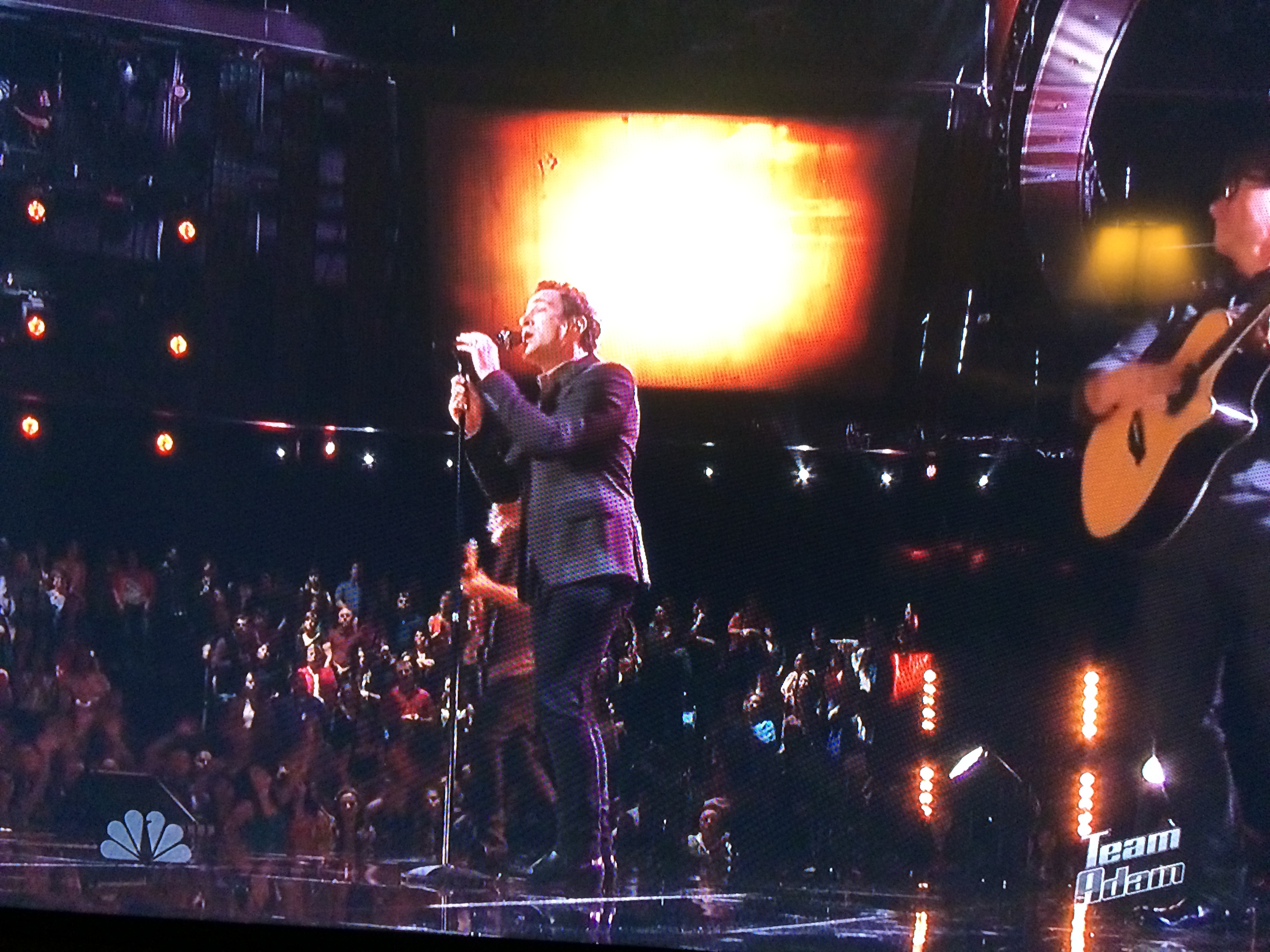 Joshua Davis soars to Top 10 on The Voice with ‘America’