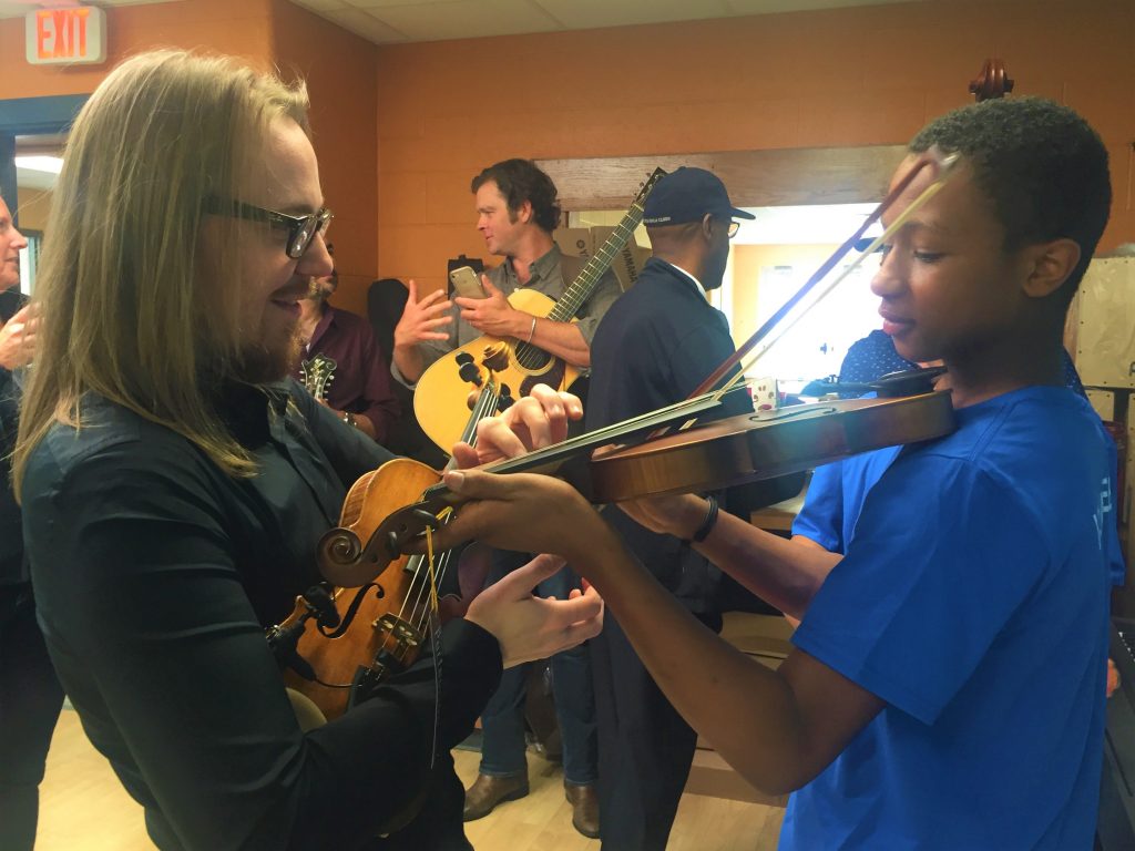 Steep Canyon Rangers and CAN'd Aid donate 16 instruments to GR kids